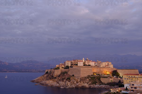 The citadel (castle) of Calvi surrounded by the mediterranean sea in ...