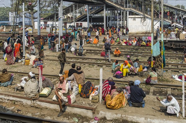 Crowds of people waiting for delayed trains all over the railway ...