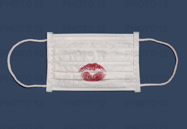 White face mask with kissing mouth - Photo12-imageBROKER-Anne-Sophie ...