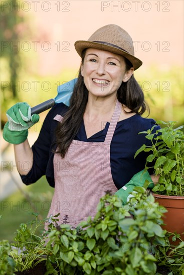Woman doing gardening on a raised bed - Photo12-imageBROKER-Michaela ...