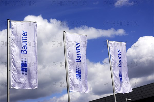 Three flags of the company Baumer - Photo12-imageBROKER-Siegra Asmoel