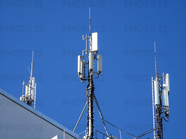 Mobile phone masts on a high-rise building - Photo12-imageBROKER ...