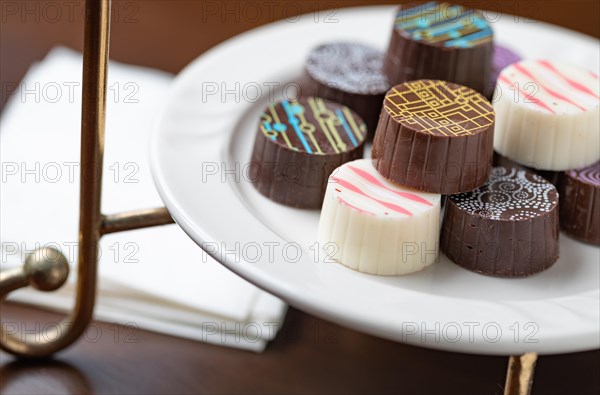Artisan fine chocolate candy on serving dish - Photo12-imageBROKER-Andy ...