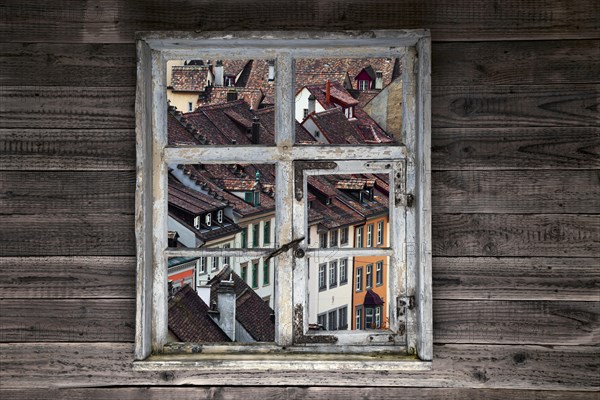 View through a rustic wooden window onto the old town - Photo12 ...