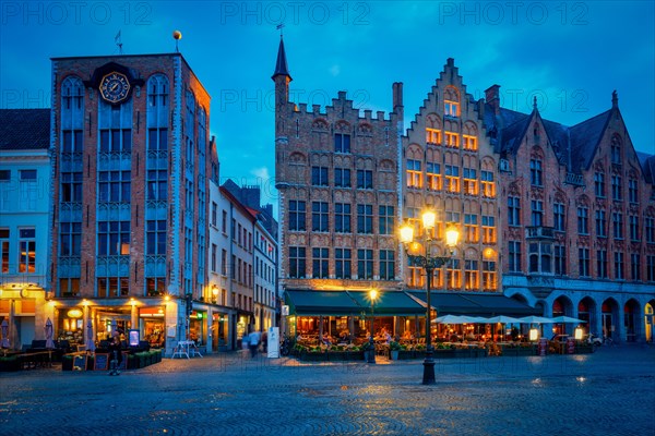 Bruges Grote markt square famous tourist place with many cafe and ...
