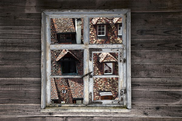 View through a rustic wooden window onto the old town - Photo12 ...