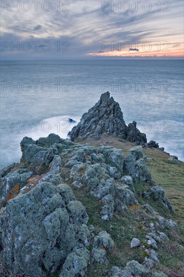 View of craggy basalt rocks on coastal headland at sunset - Photo12 ...