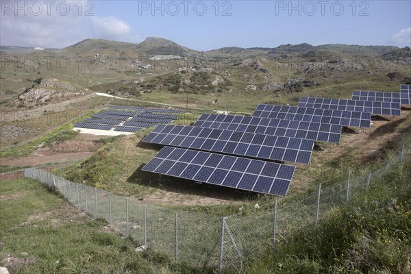 Solar panels in field on hillside - Photo12-imageBROKER-Mike Lane