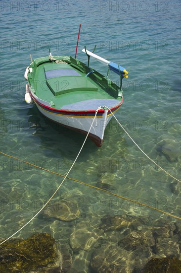 Small fishing boat moored in shallow water - Photo12-imageBROKER-Bjorn ...