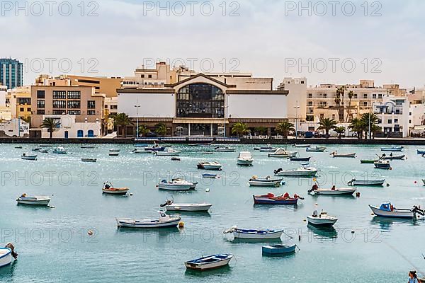 Beautiful quay with historic architecture and boats on blue water in ...