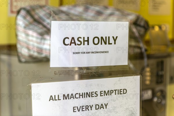 Cash Only sign on window of launderette - Photo12-imageBROKER-Ian Murray
