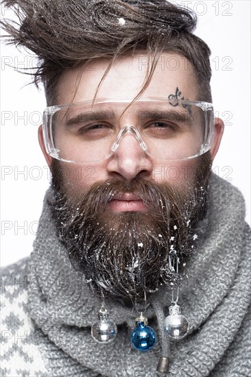 Funny bearded man in a New Year's image with snow and decorations on ...