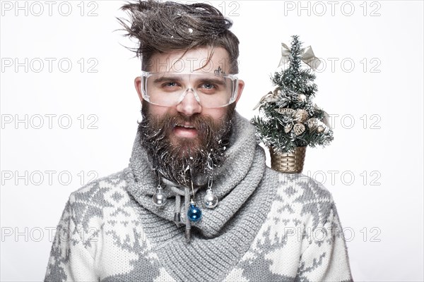 Funny bearded man in a New Year's image with snow and decorations on ...
