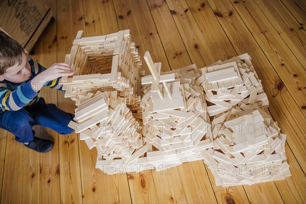 Symbolic photo on the subject of creative play among children. A boy ...