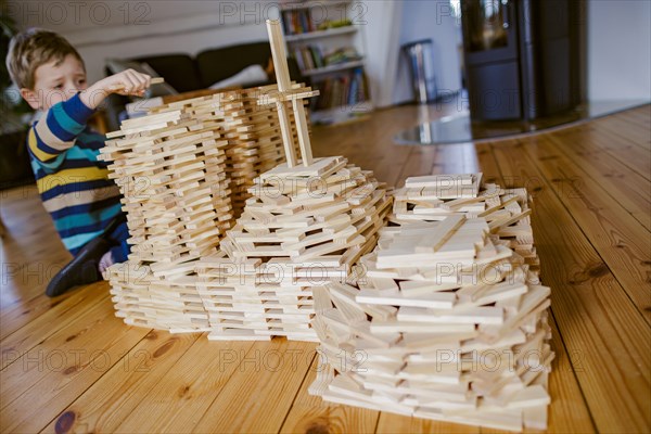 Symbolic photo on the subject of creative play among children. A boy ...