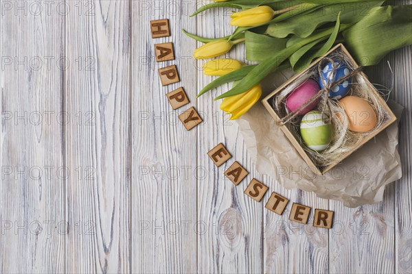 Happy easter writing near tulips eggs - Photo12-imageBROKER-Oleksandr ...