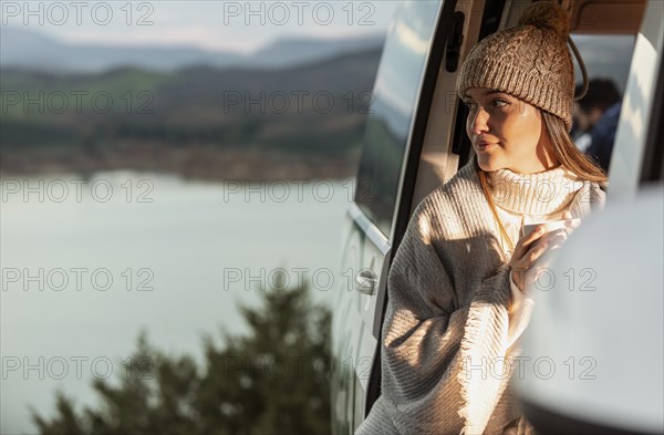 Woman enjoying nature view from car while road trip - Photo12-imageBROKER