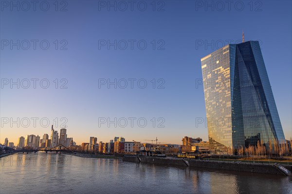 The light of the setting winter sun falls sideways on the buildings of ...