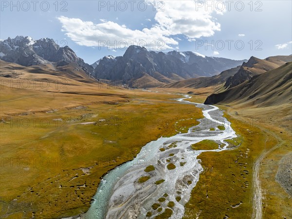 Aerial view, River Kol Suu winds through a mountain valley with hills ...