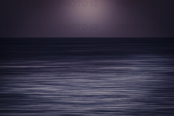 Gray seascape at sunset - Photo12-Tetra Images-Fabio Camandona